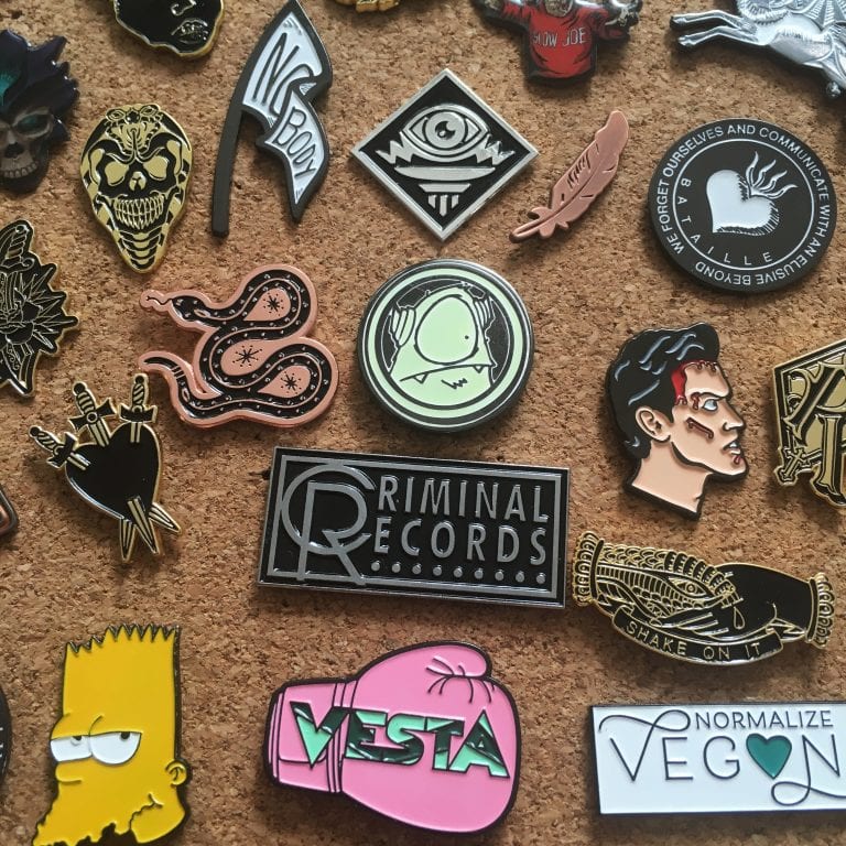 History and Origins of Enamel pins – All you Need to Know - WhiteOut Press